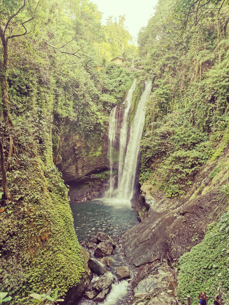These Secret Bali Waterfalls Boast A Natural Slide & Are Instagram-Perfect