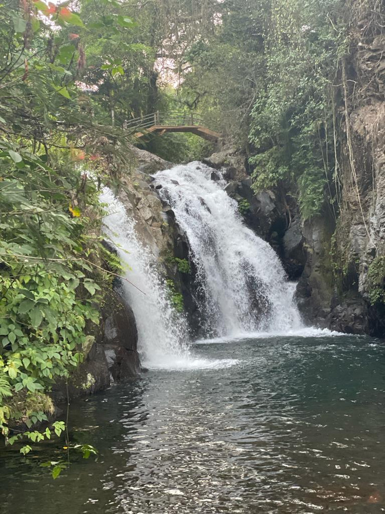 These Secret Bali Waterfalls Boast A Natural Slide & Are Instagram-Perfect
